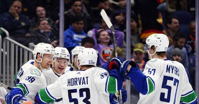 Canucks score twice early in third, rally past Islanders 4-3