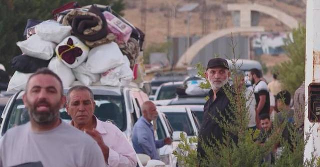 People fleeing conflict in Lebanon flood border crossing into Syria