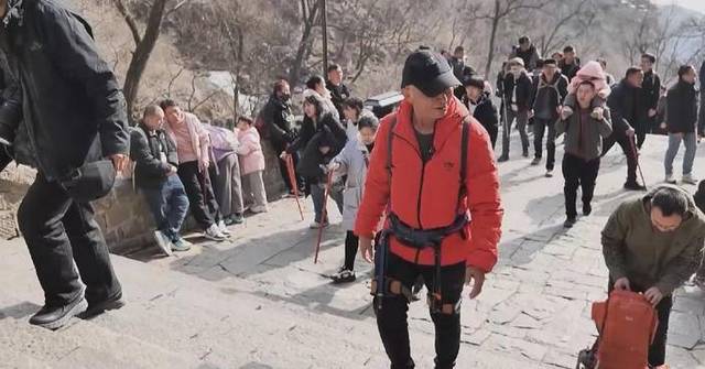Robotic exoskeletons help visitors climb Mount Tai during Spring ...