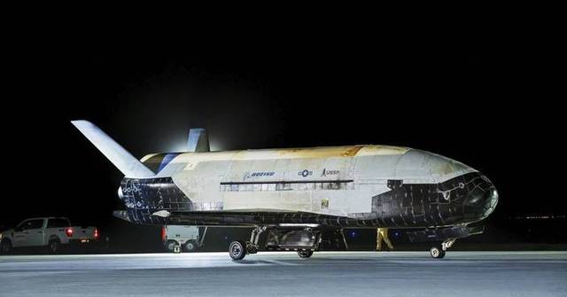 US military's mini space shuttle returns to Earth after orbiting for ...