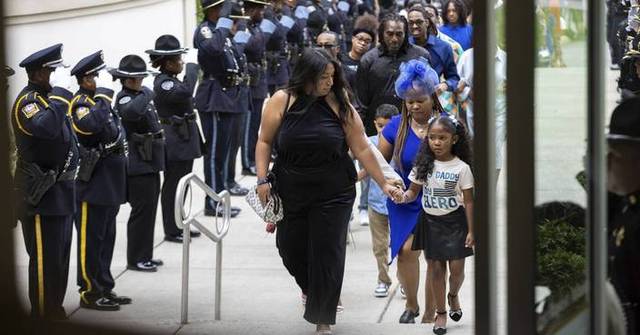 Law enforcement officers remember police officer killed in CDC shooting ...