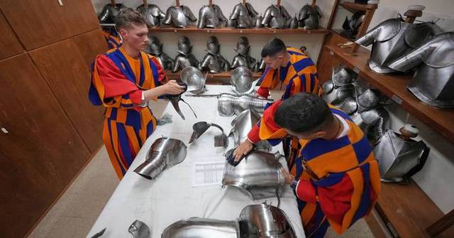 A look at Swiss Guards preparing for a swearing-in ceremony attended by ...