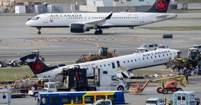 Mangled plane in LaGuardia crash is towed from runway as most injured ...